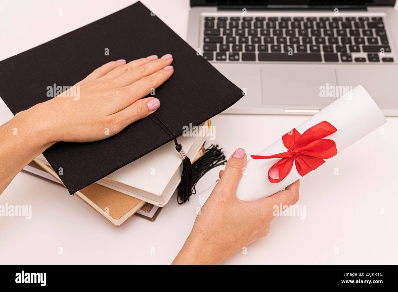 Graduation diploma certificate graduation hat Stock Photo - Alamy