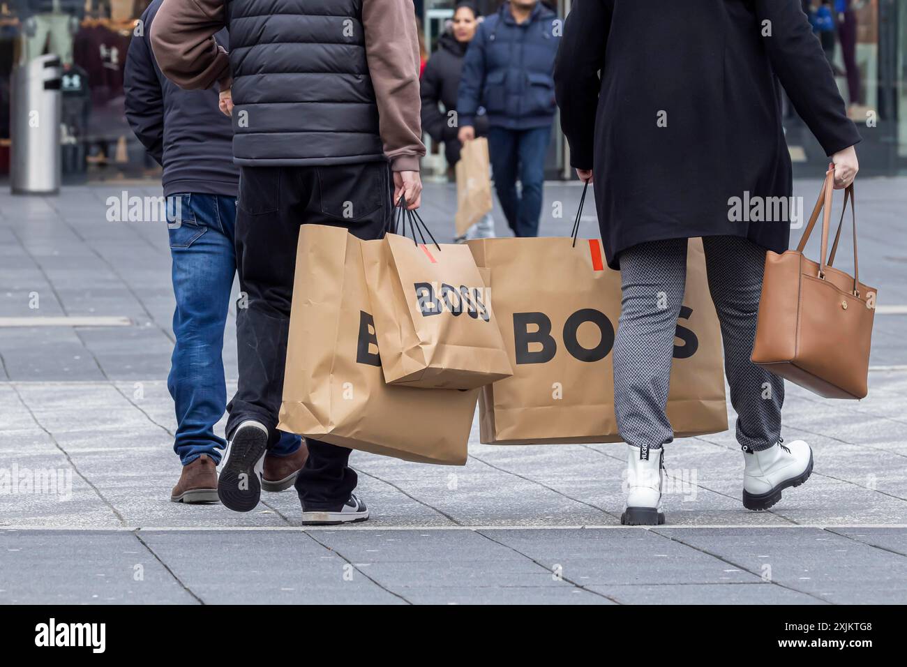 Consumer tourist lugging shopping bags, factory outlet, Outletcity ...