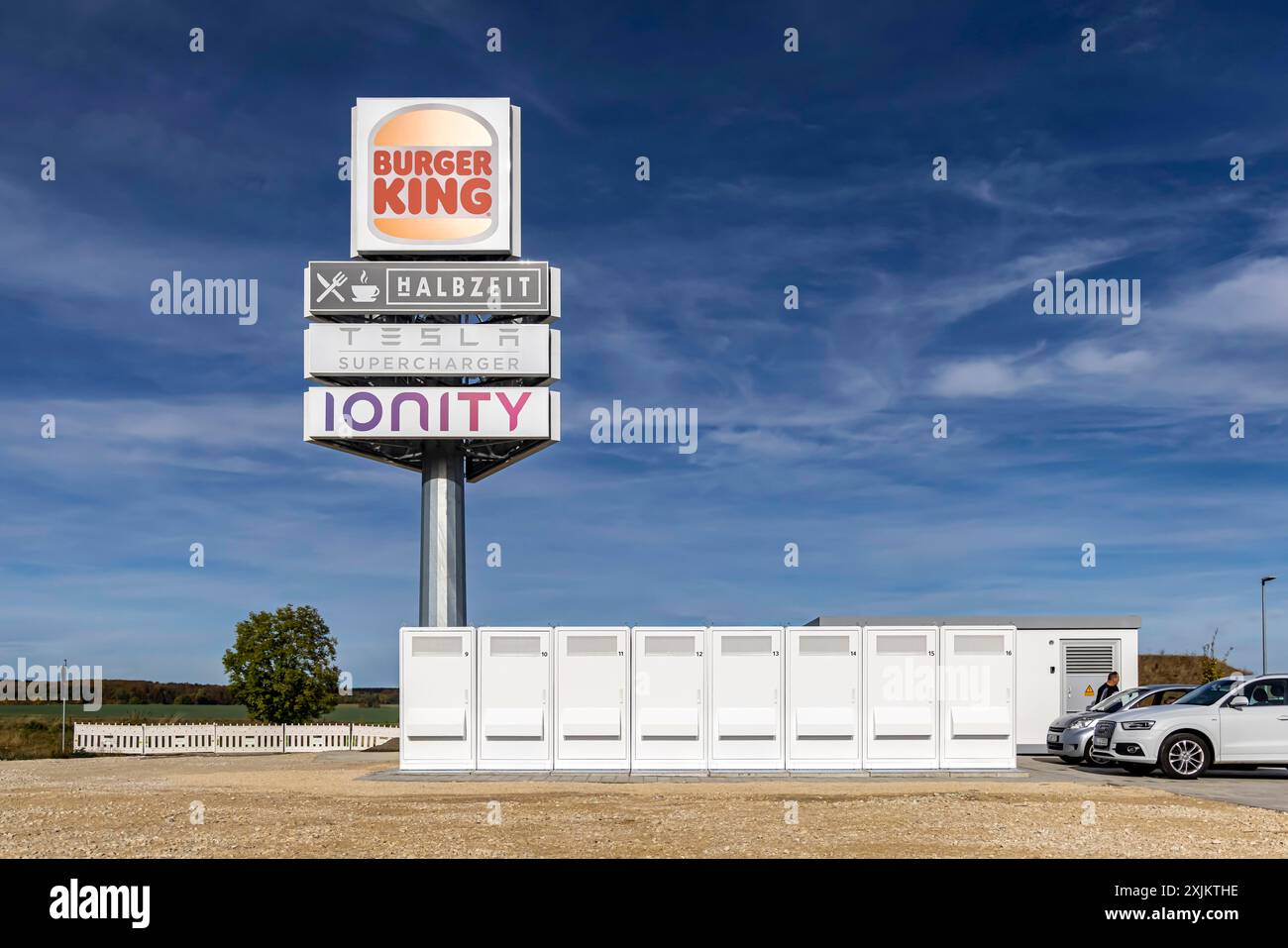 Ionity and Tesla charging station on the A8 motorway, advertising pylon ...