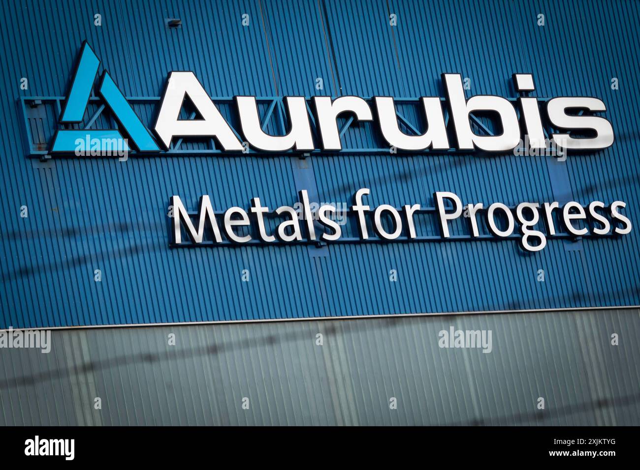 Logo and lettering Aurubis Metal for Progress on a factory building at the Aurubis AG plant ...
