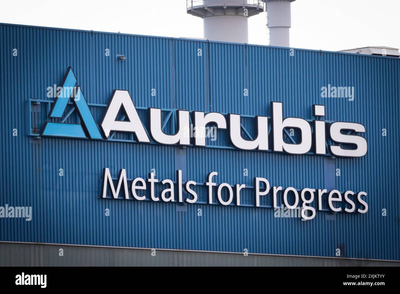 Logo and lettering Aurubis Metal for Progress on a factory building at the Aurubis AG plant ...