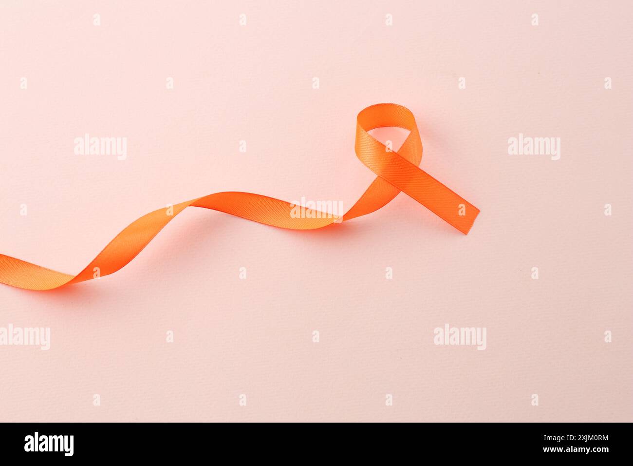 Orange awareness ribbon on beige background, top view Stock Photo - Alamy