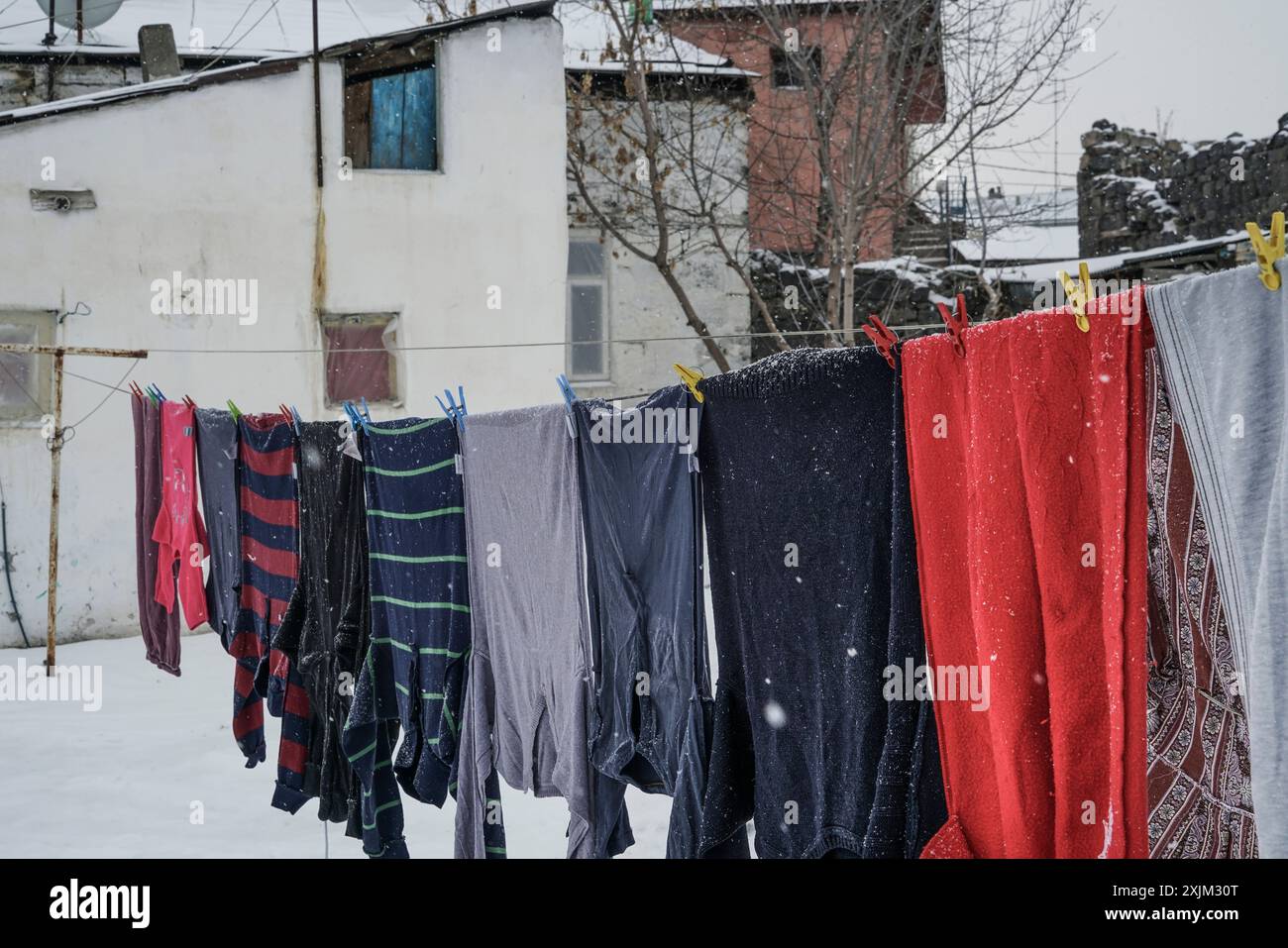 Washing clothes in winter hi-res stock photography and images - Alamy