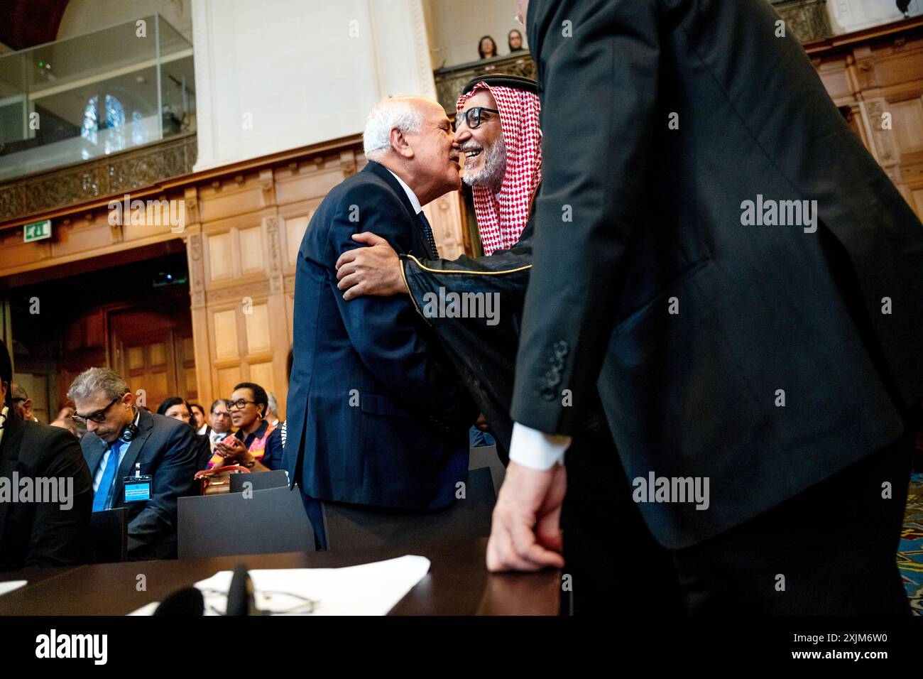 THE HAGUE - Members of the Palestinian delegation are greeted at the ...
