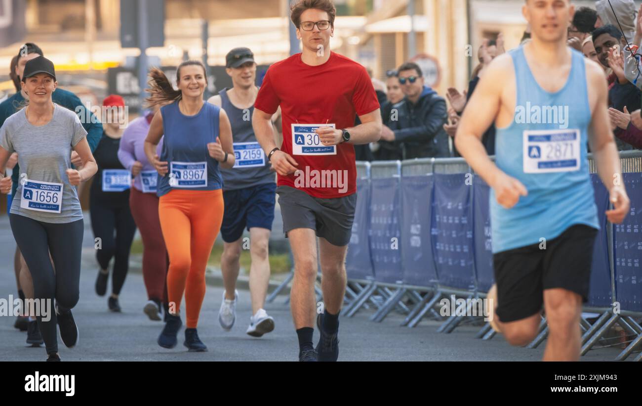 Group diverse friends competing cheering hi-res stock photography and ...