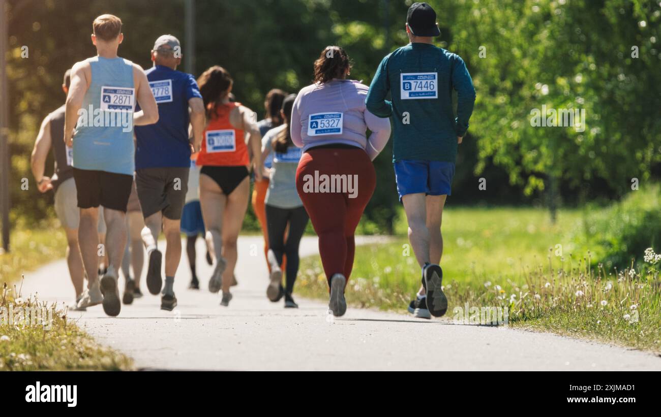 Wide Shot Back View of Diverse Marathon Participants Competing in a ...