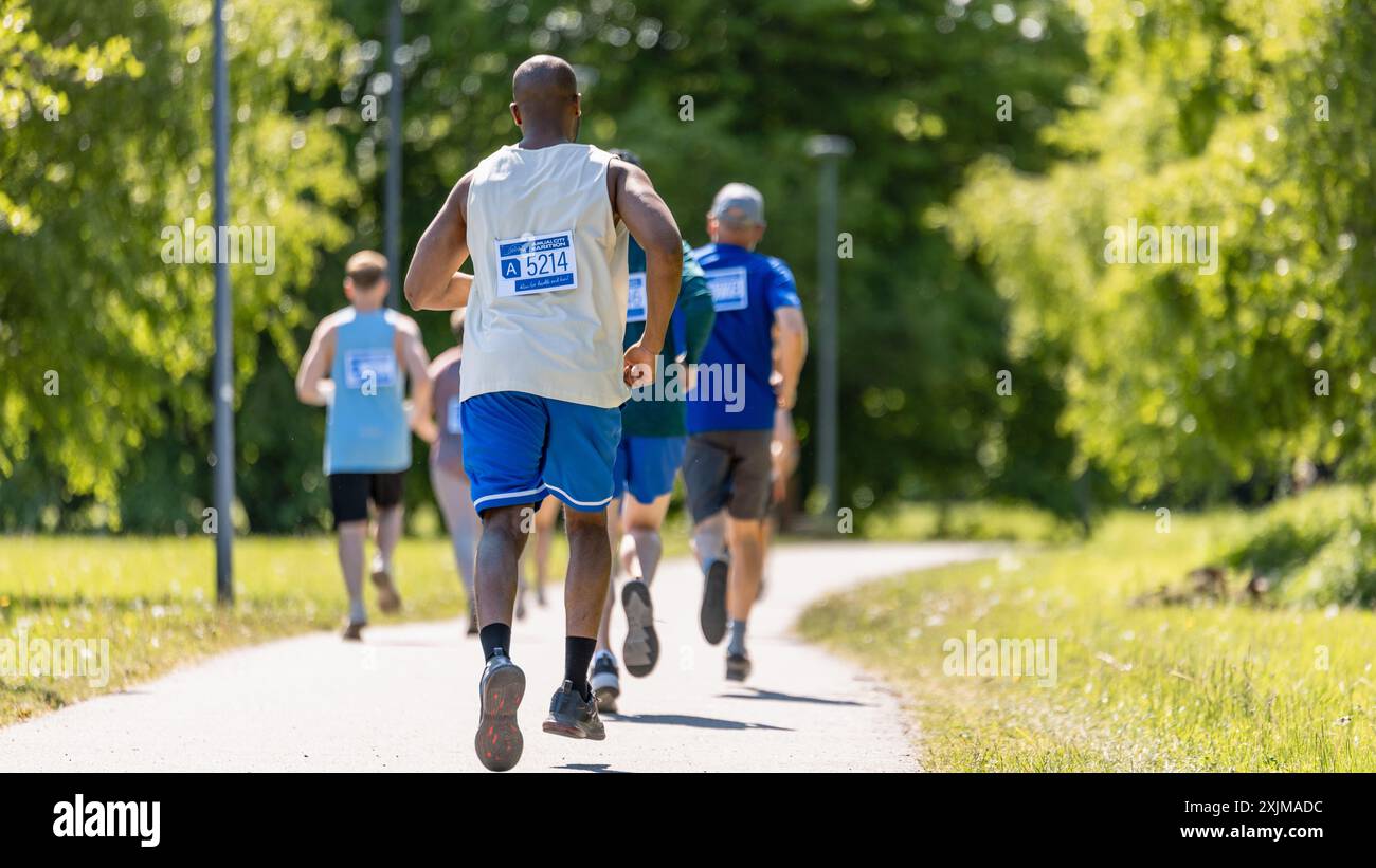 Back View of Diverse Marathon Participants Competing in a Race for the ...