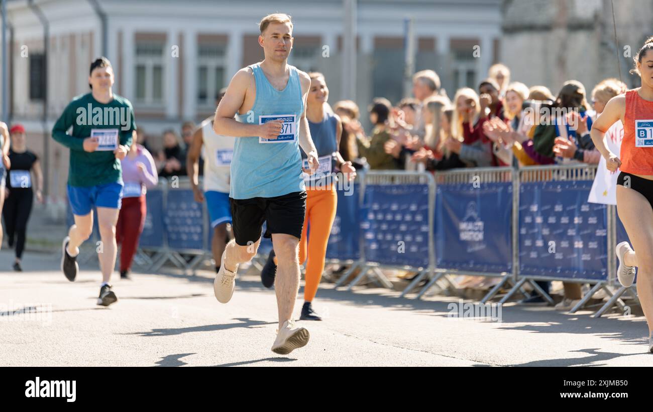 Happy Group of People Participating in a City Marathon. Diverse Race ...