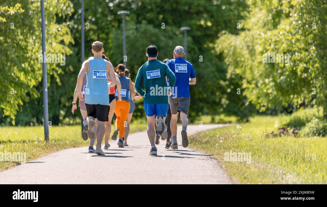 Wide Shot Back View of Diverse Marathon Participants Competing in a ...