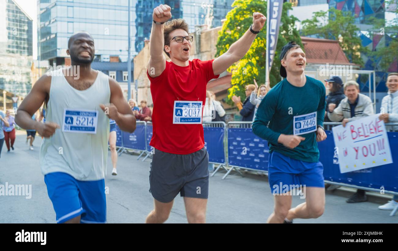 Happy Young Male Celebrating, Raising Hands While Crossing the Finish ...