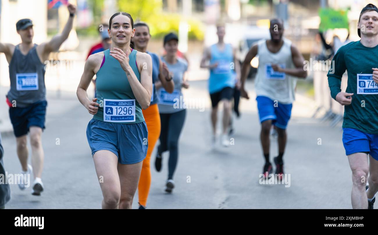 Diverse Group of People Running a Marathon in a City During the Day ...