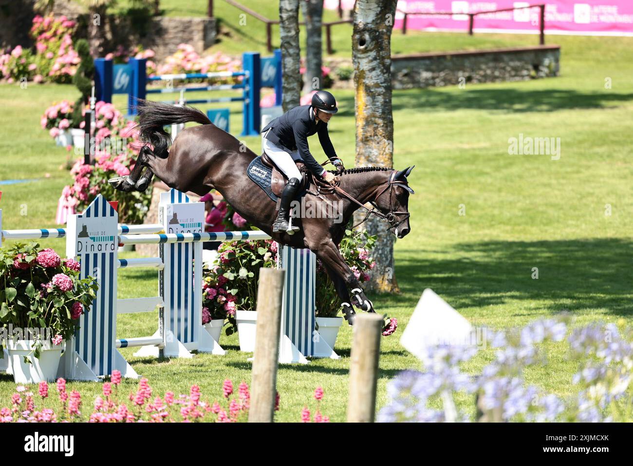 Max Kühner of Austria with Eic Cooley Jump The Q during the CSI5* Prix ...