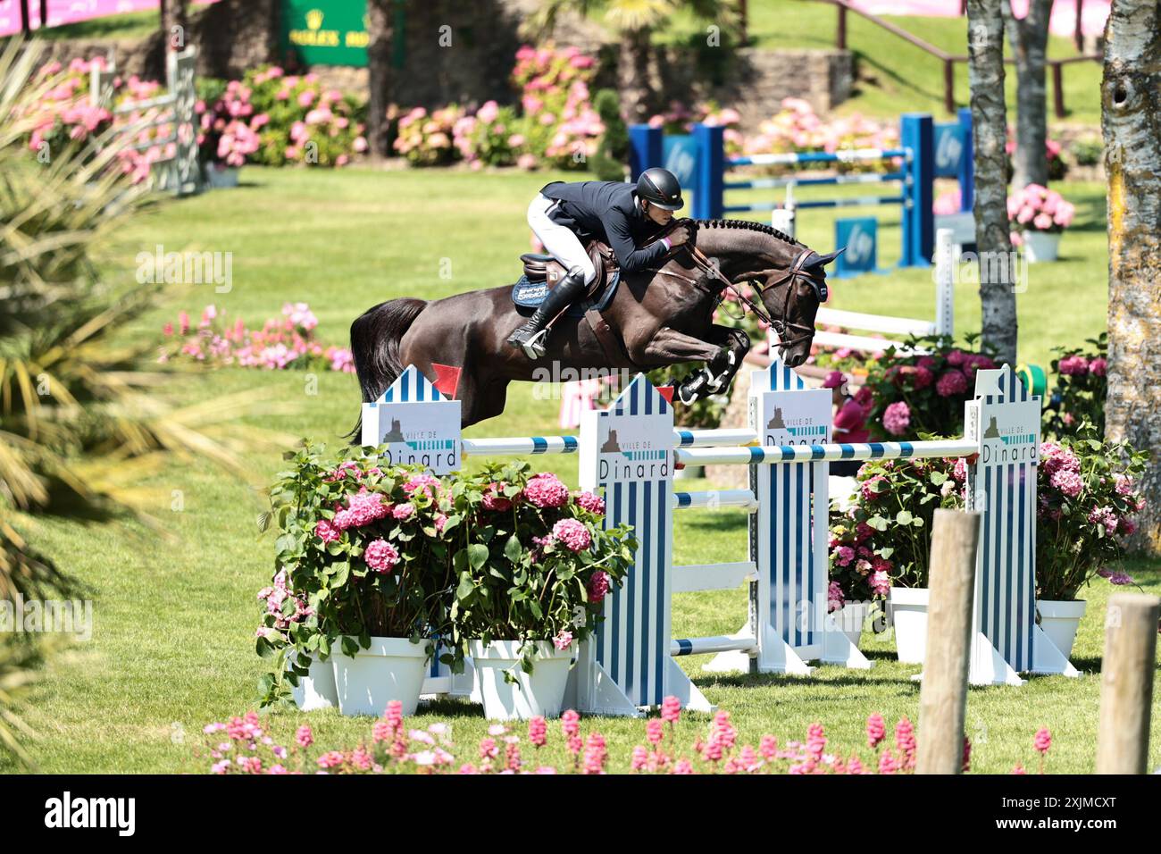 Max Kühner of Austria with Eic Cooley Jump The Q during the CSI5* Prix ...