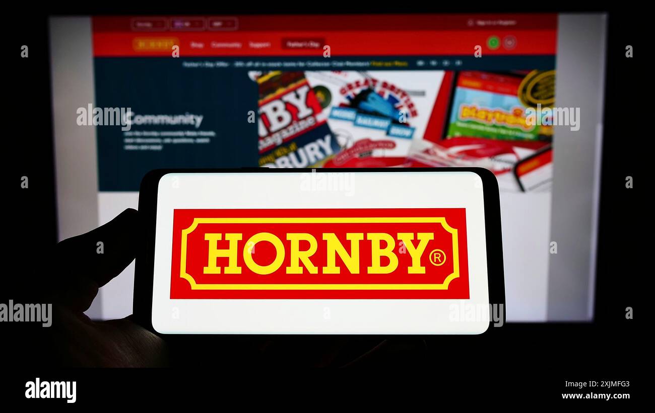 Stuttgart, Germany, 06-19-2022: Person holding cellphone with logo of ...