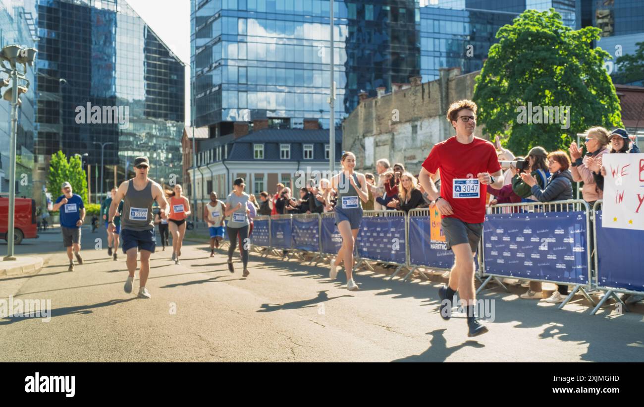 Diverse Group of People Competing in a Marathon Race in the City ...