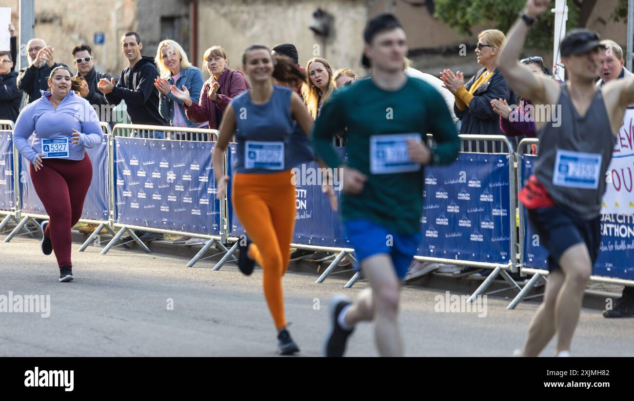 Diverse Group of People Running a Marathon in a City During the Day ...