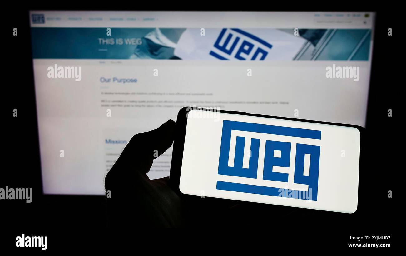 Stuttgart, Germany, 07-23-2022: Person holding smartphone with logo of ...