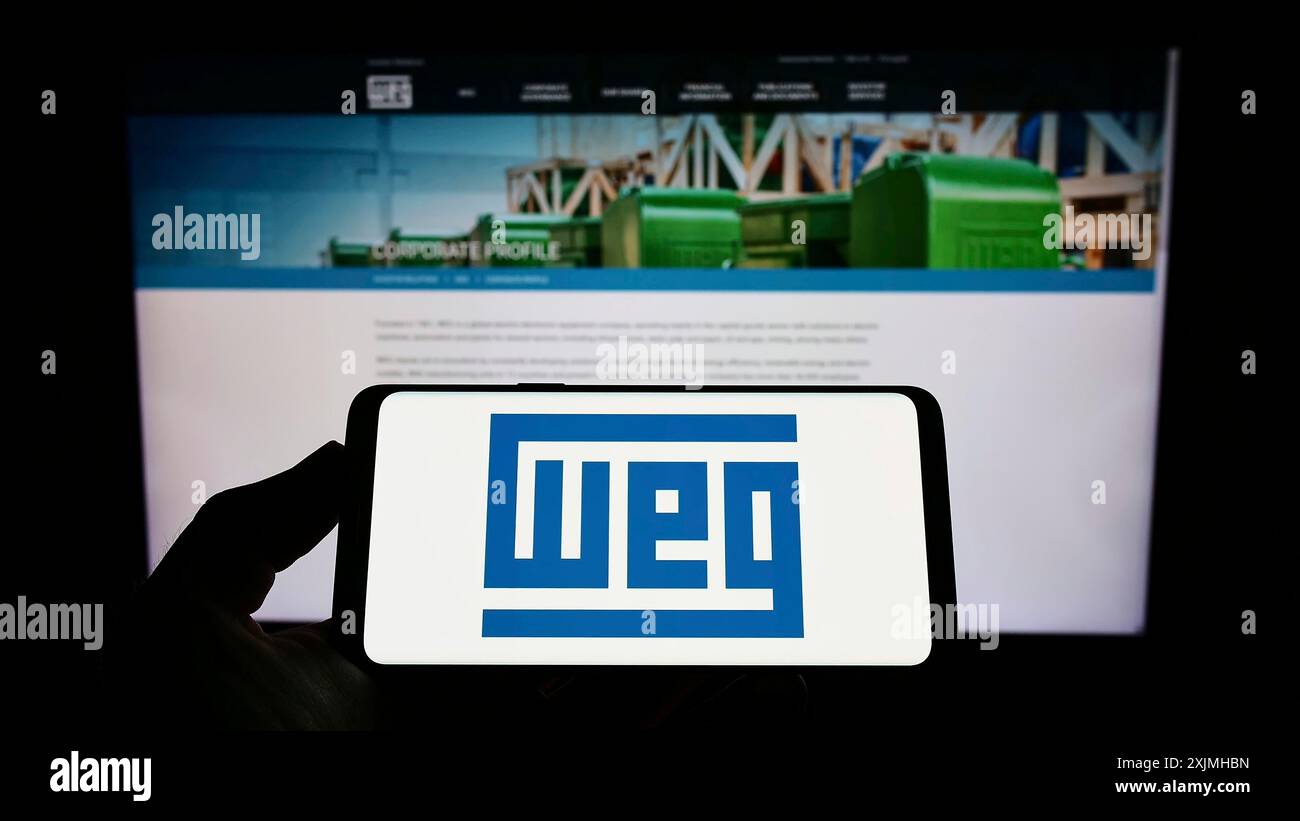 Stuttgart, Germany, 07-23-2022: Person holding mobile phone with logo ...