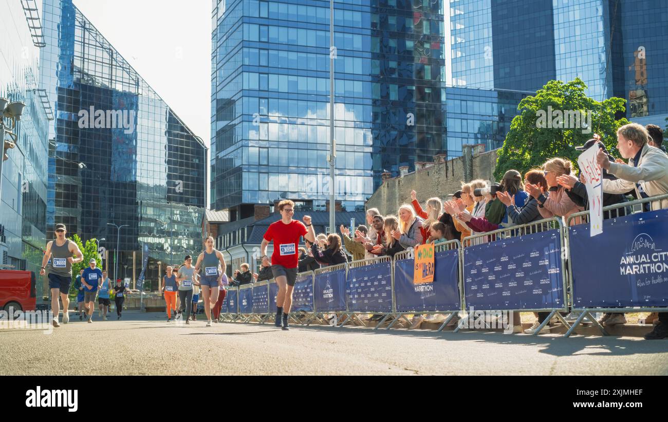 Diverse Group of People Competing in a Marathon Race in the City ...