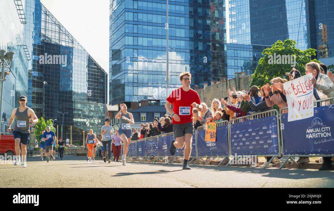 Group diverse friends competing cheering hi-res stock photography and ...