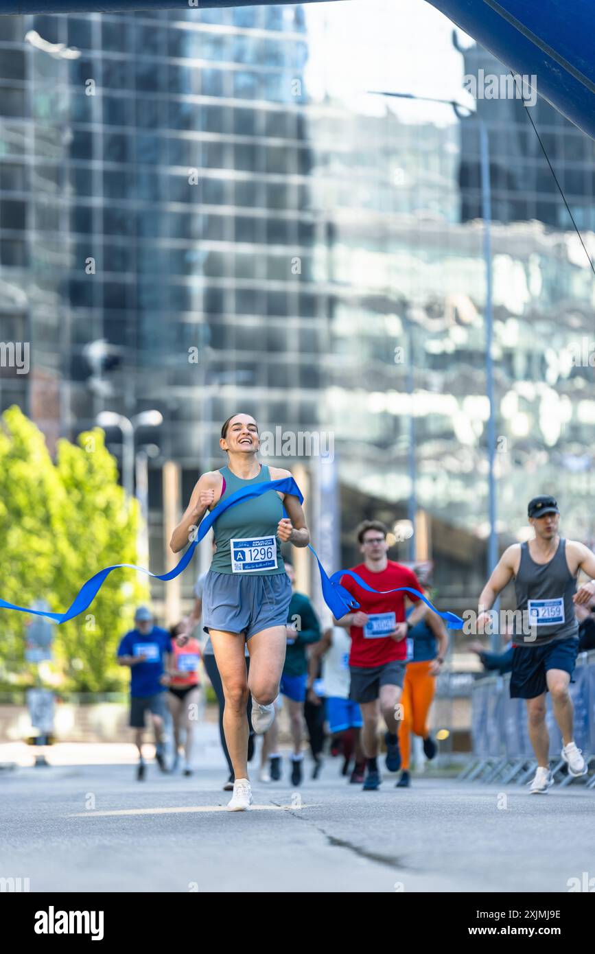 Portrait of Athletic Female Jogger Crossing the Finish Line in Marathon ...