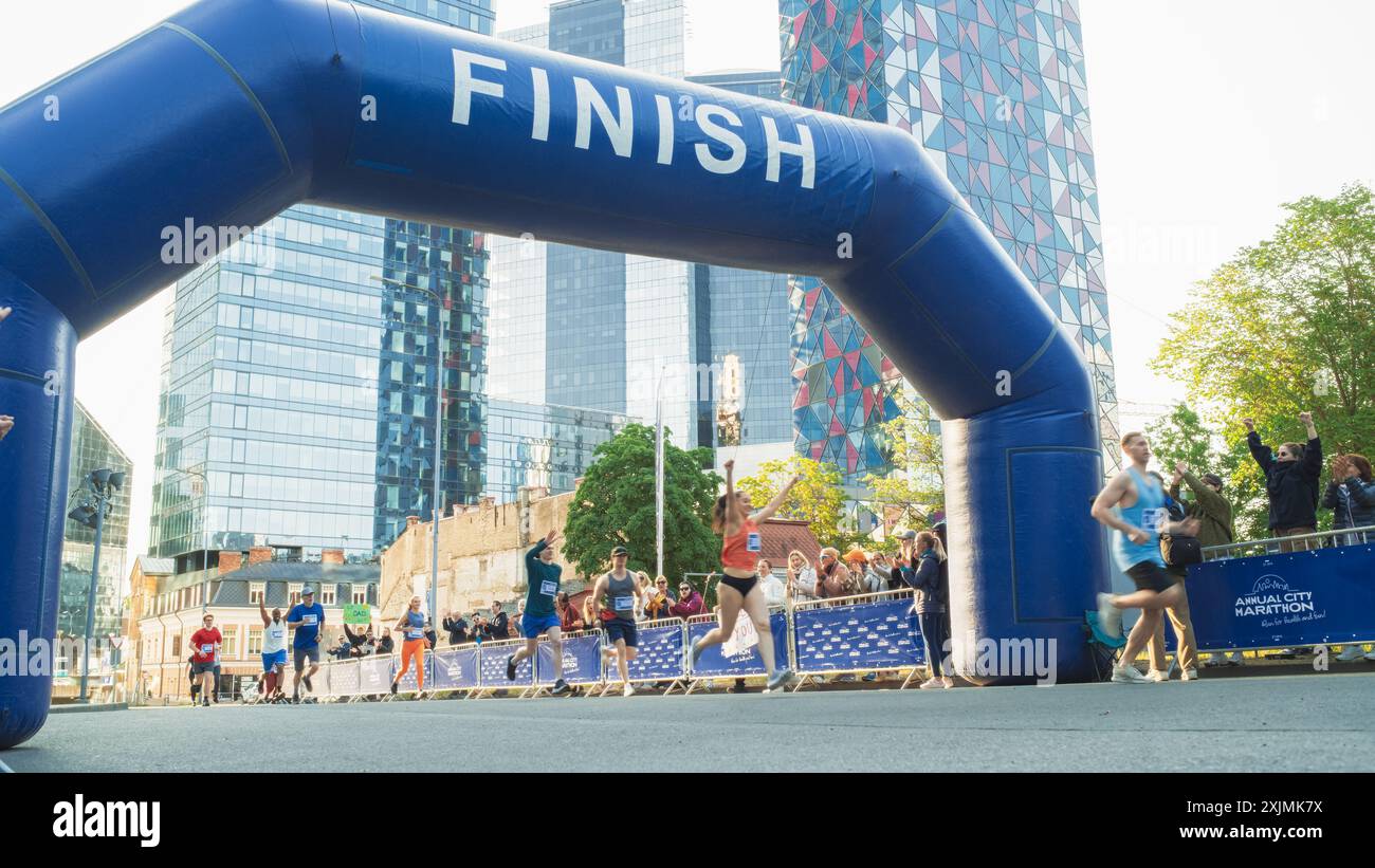 Wide Shot of a Diverse Group of Runners Participating in a City ...