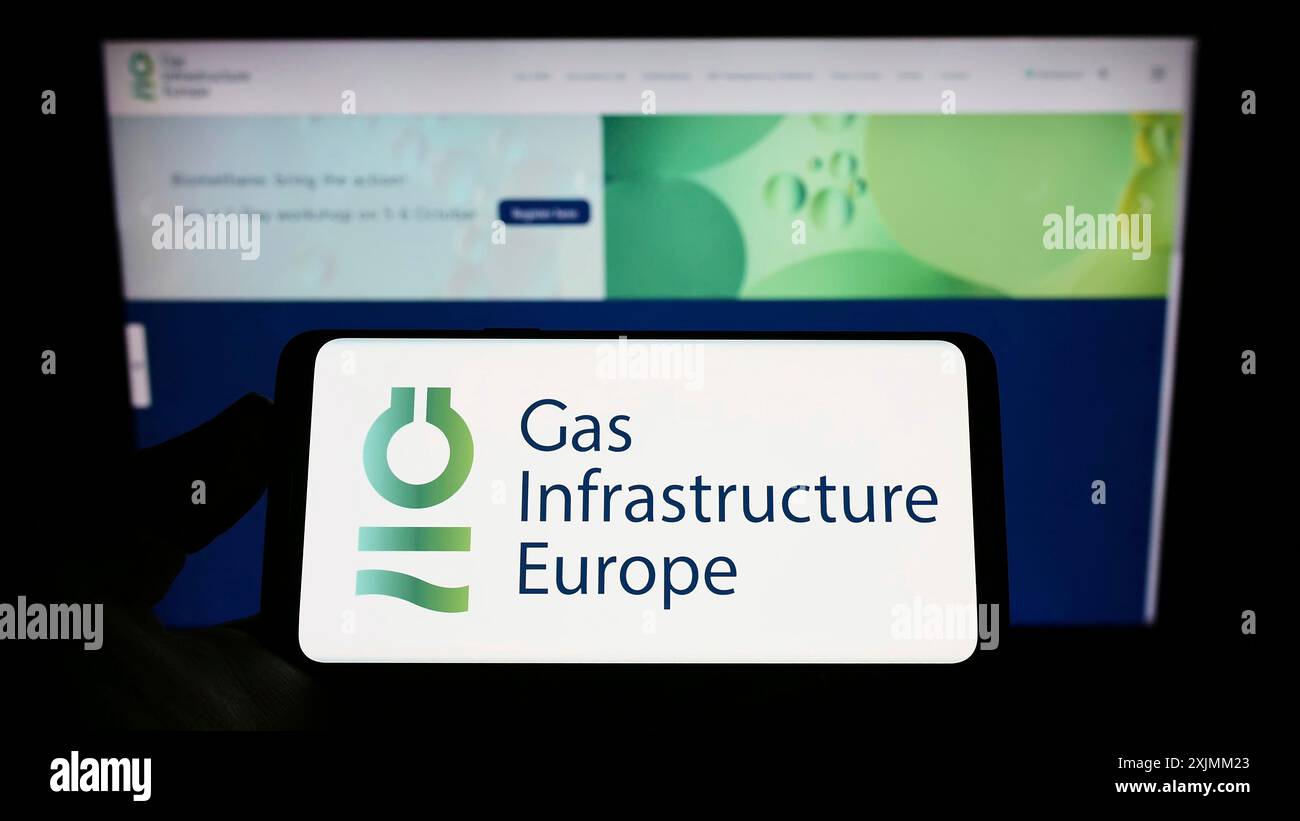 Stuttgart, Germany, 09-07-2022: Person holding smartphone with logo of ...