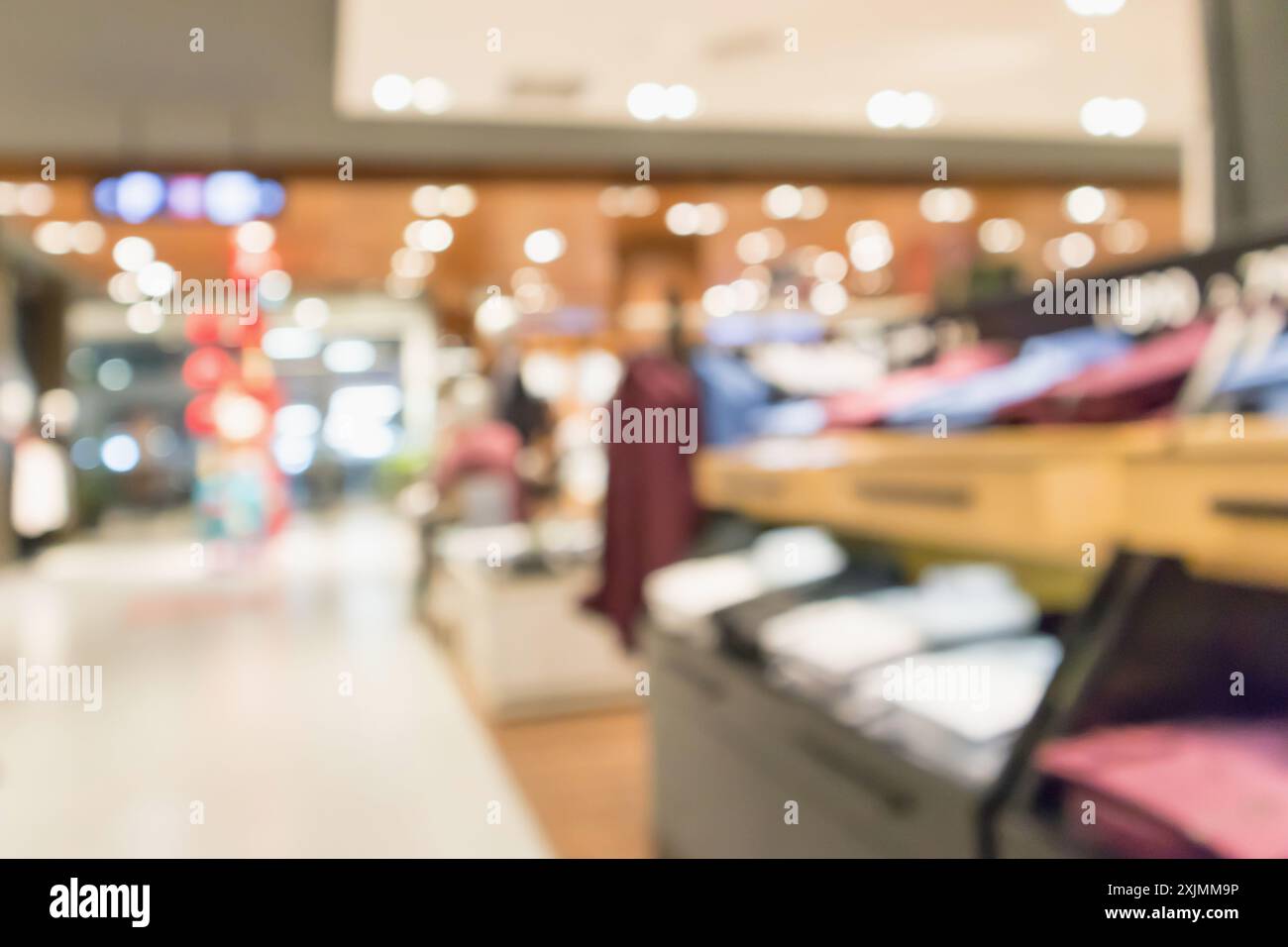 Abstract blur clothing boutique display interior of shopping mall ...