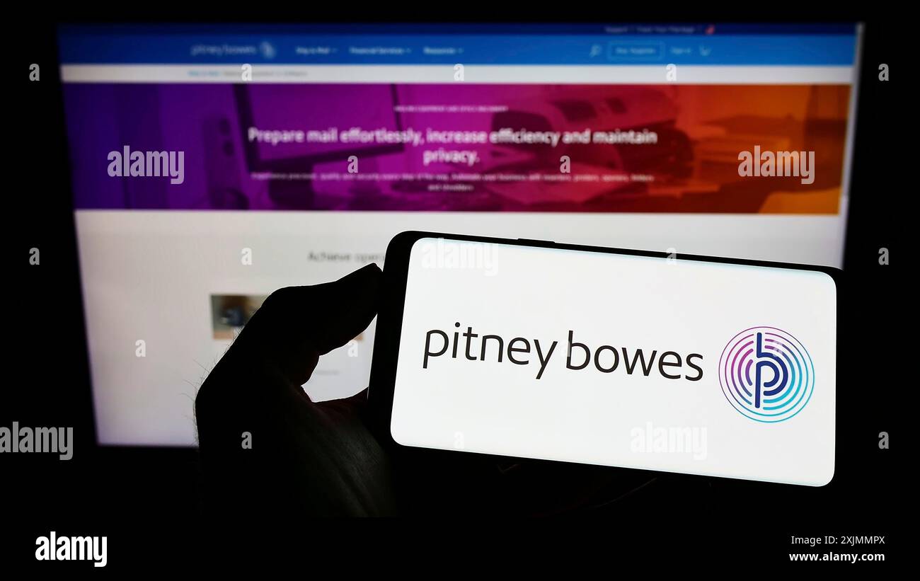 Stuttgart, Germany, 09-09-2022: Person holding mobile phone with logo of American technology ...