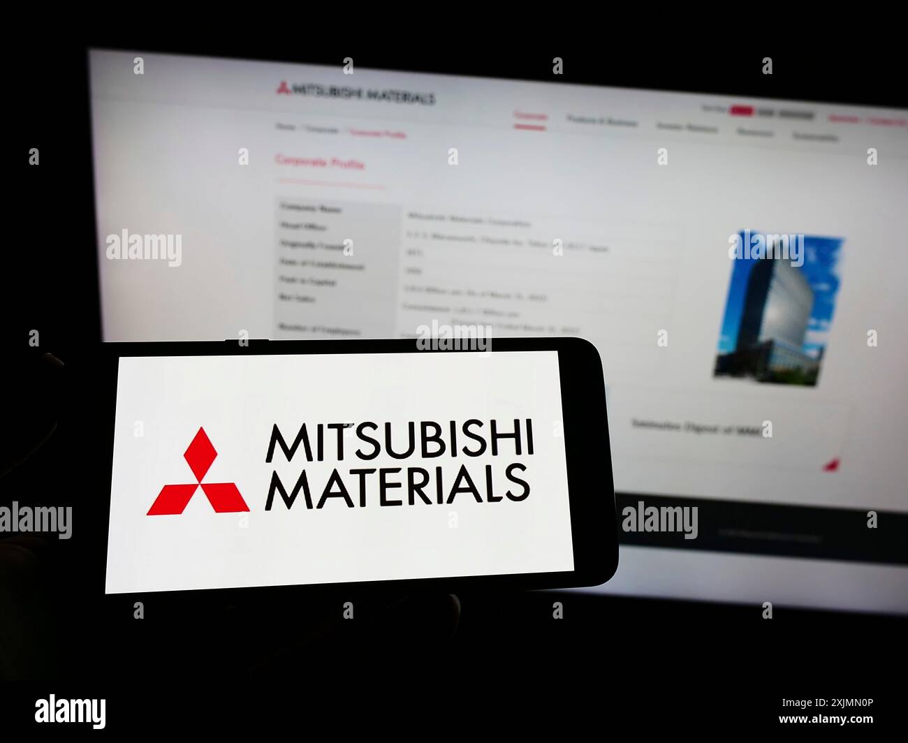 smartphone with logo of company Mitsubishi Materials Corporation (MMC ...