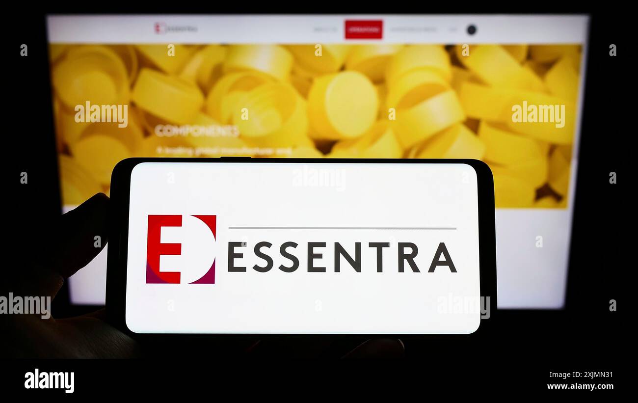 Stuttgart, Germany, 09-10-2022: Person holding smartphone with logo of British manufacturing ...