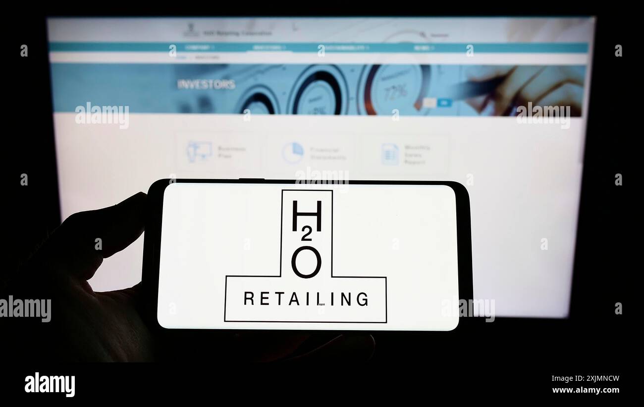 Stuttgart, Germany, 09-15-2022: Person holding cellphone with logo of Japanese company H2O ...