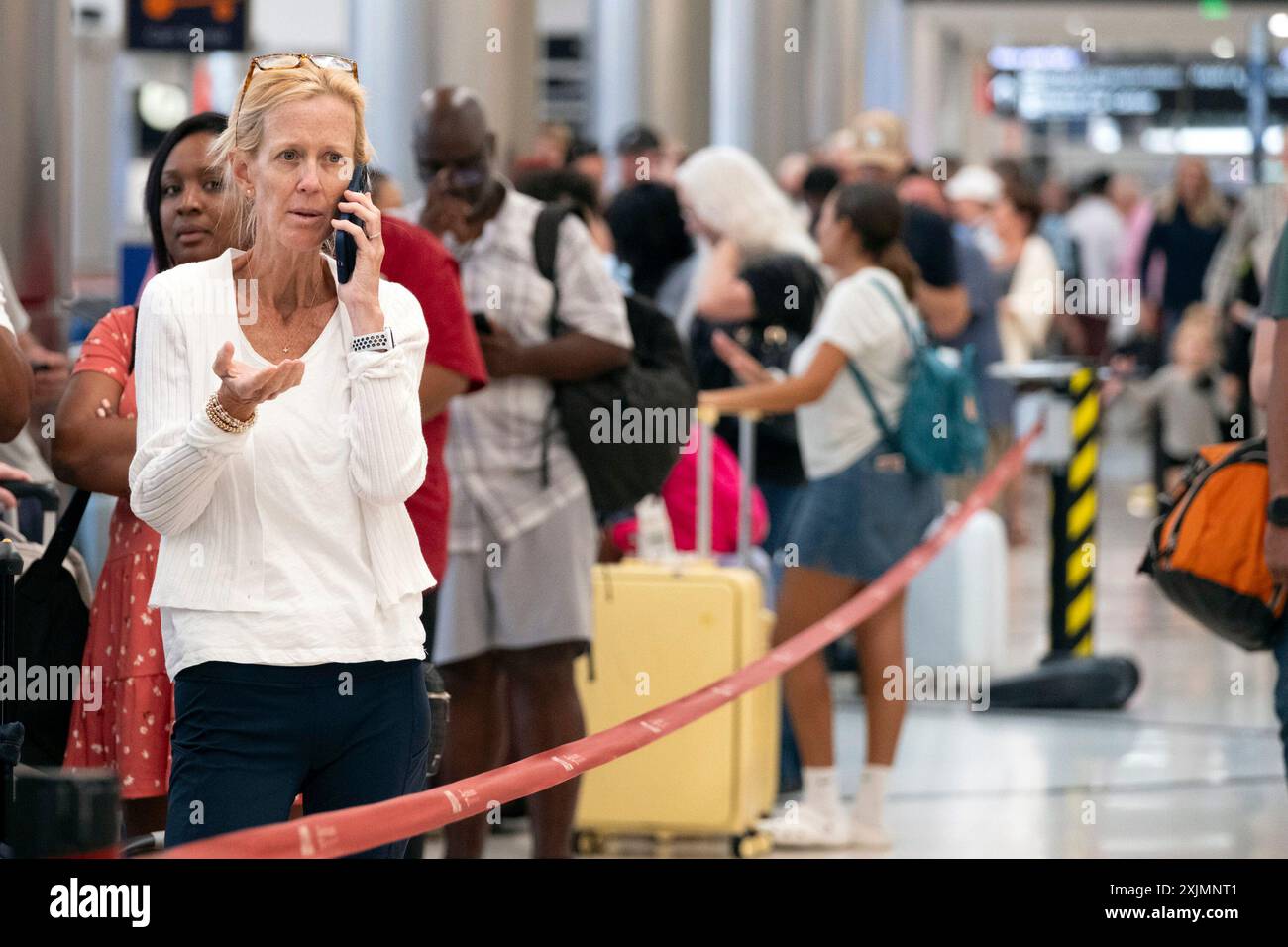 Jenna Leach waits in line at Hartsfield Jackson International Airport ...