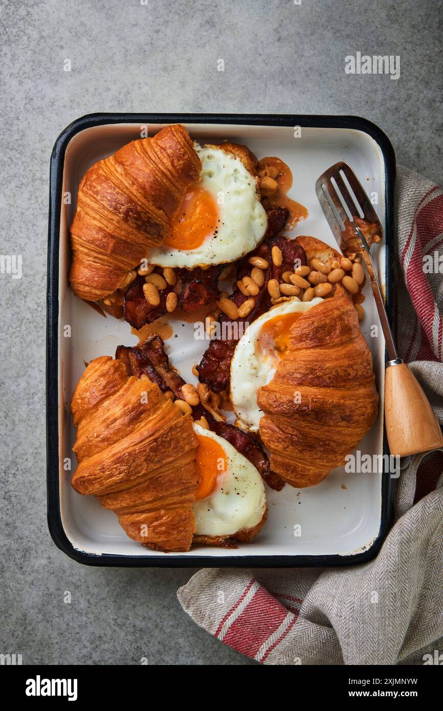 Croissants English breakfast. Delicious fresh breakfast grilled three ...