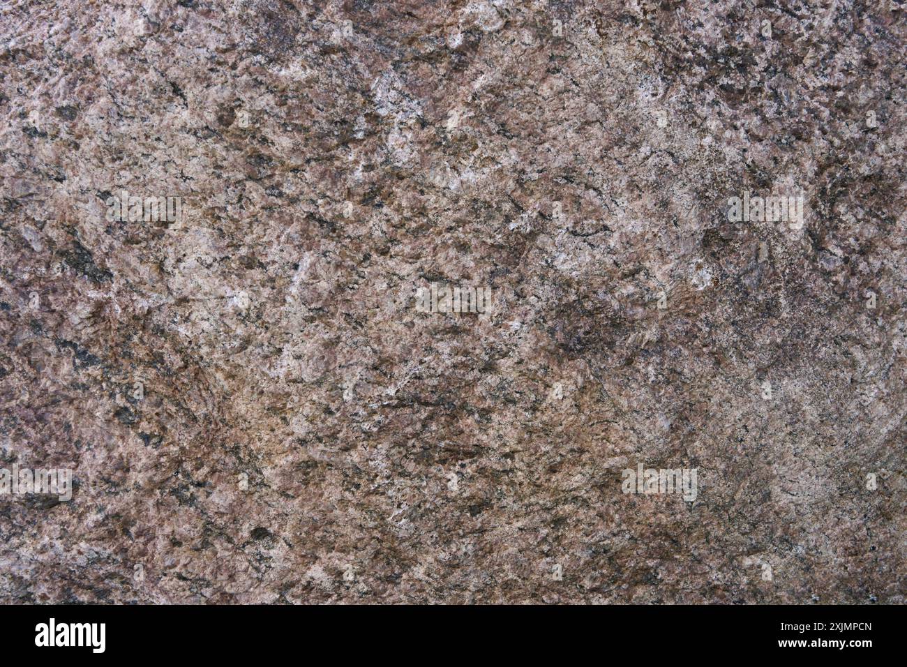 Large granite stone boulder texture background. Red granite old boulder ...