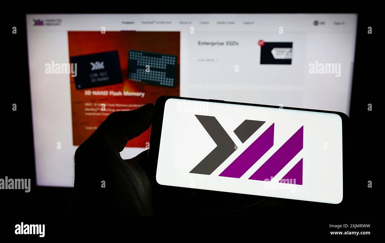 Stuttgart, Germany, 10-09-2022: Person holding mobile phone with logo ...