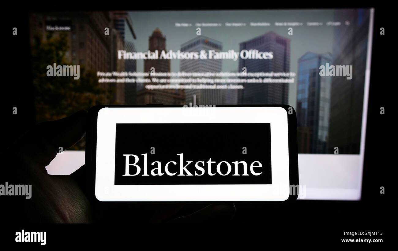 Stuttgart, Germany, 10-14-2022: Person holding mobile phone with logo ...