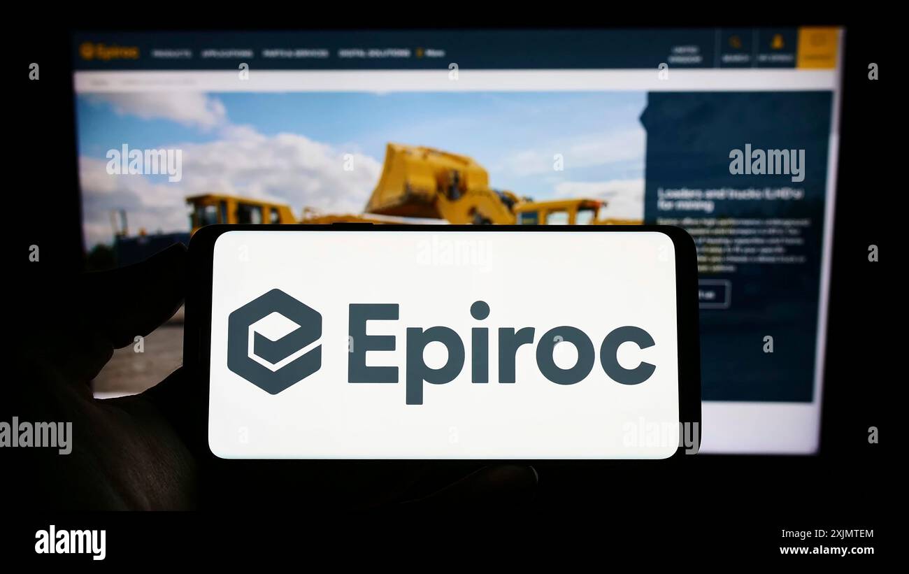 Stuttgart, Germany, 10-26-2022: Person holding cellphone with logo of Swedish engineering ...