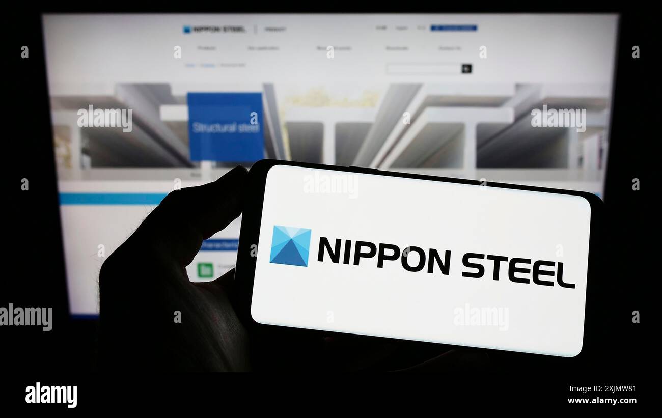 Stuttgart, Germany, 12-01-2022: Person holding smartphone with logo of ...