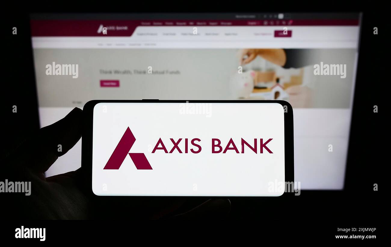 Stuttgart, Germany, 12-02-2022: Person holding smartphone with logo of Indian financial company ...