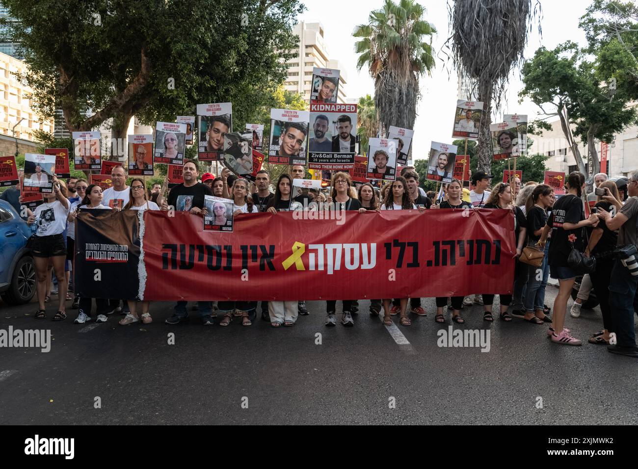 Placards with the motto “Secure a deal first, then fly", are shown ...