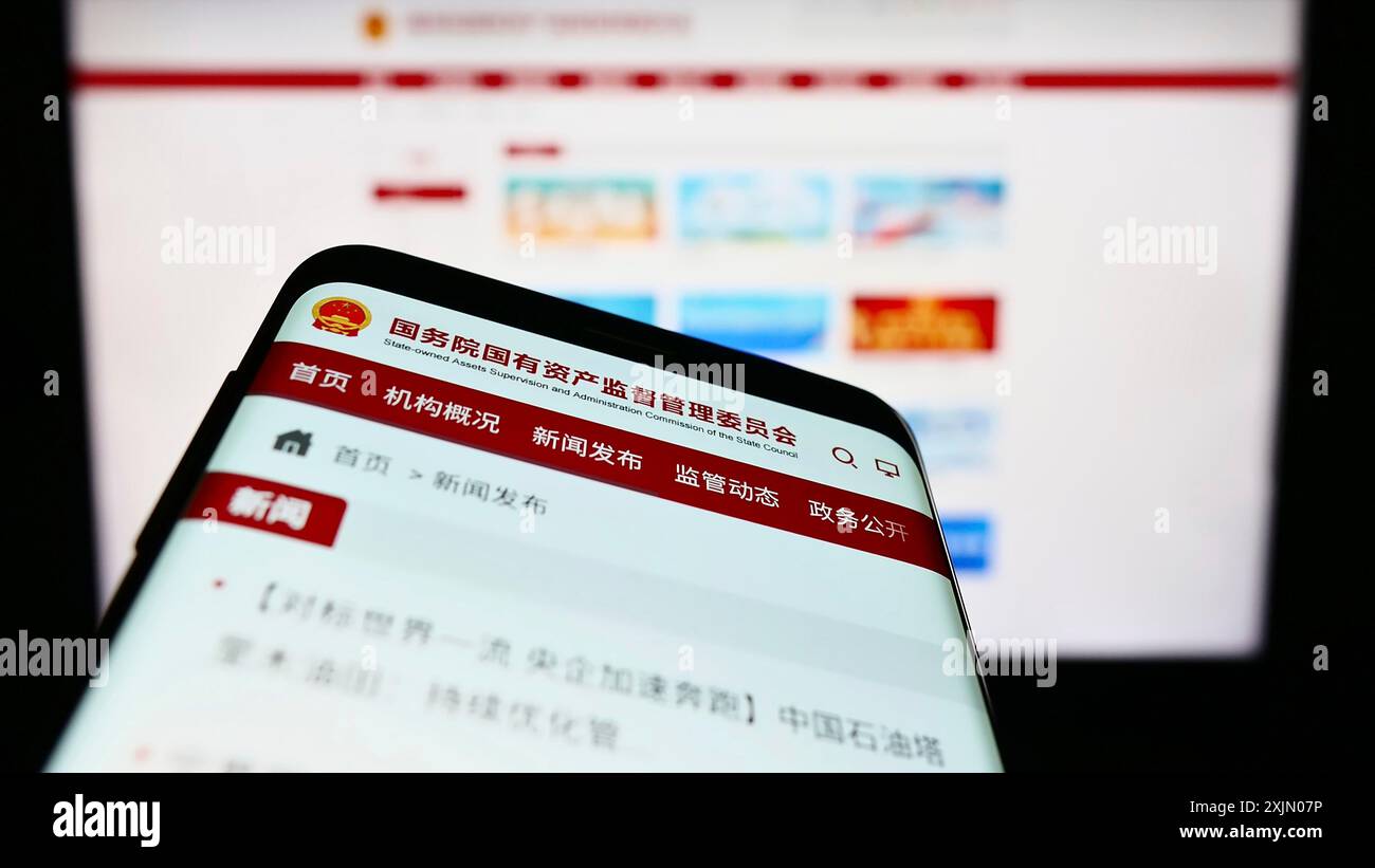 Stuttgart, Germany, 01-01-2023: Smartphone with website and logo of ...