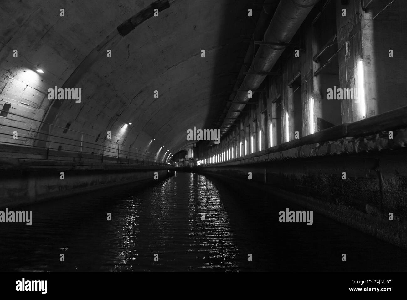 Industrial concrete tunnel perspective. Aandoned underground submarine ...