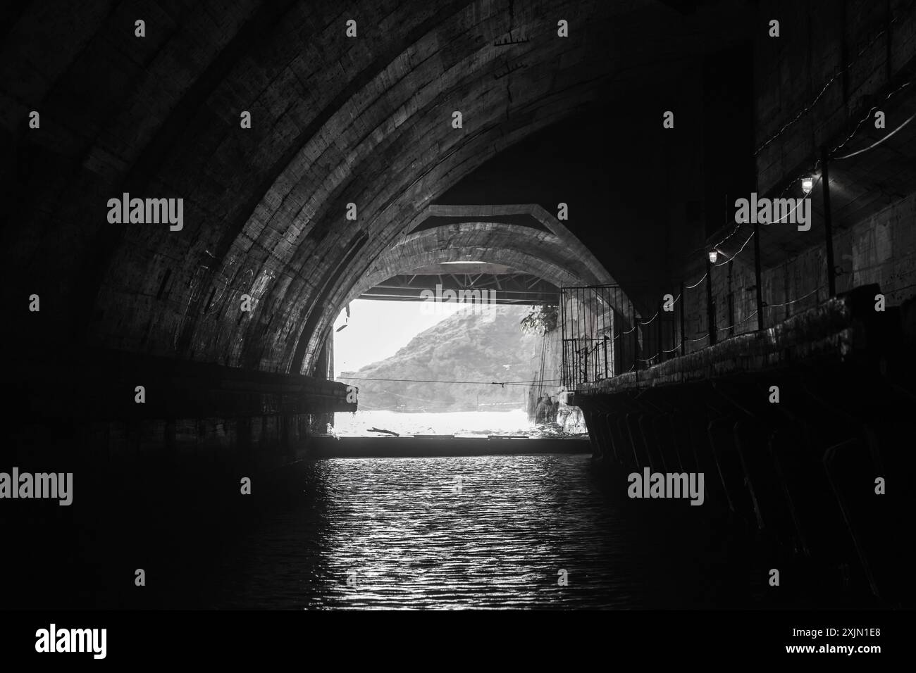 Exit gateway of an undeground concrete tunnel interior. Abandoned ...