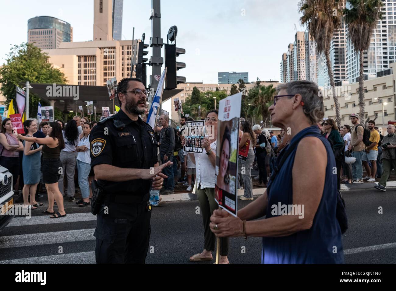 Tel Aviv, Israel. 17th July, 2024. An Israeli officer speaks at a ...