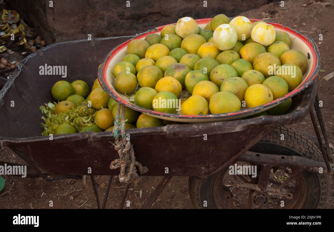 Orange stall, Kaduna State, Nigeria, Africa. Wheelbarrow used to create ...