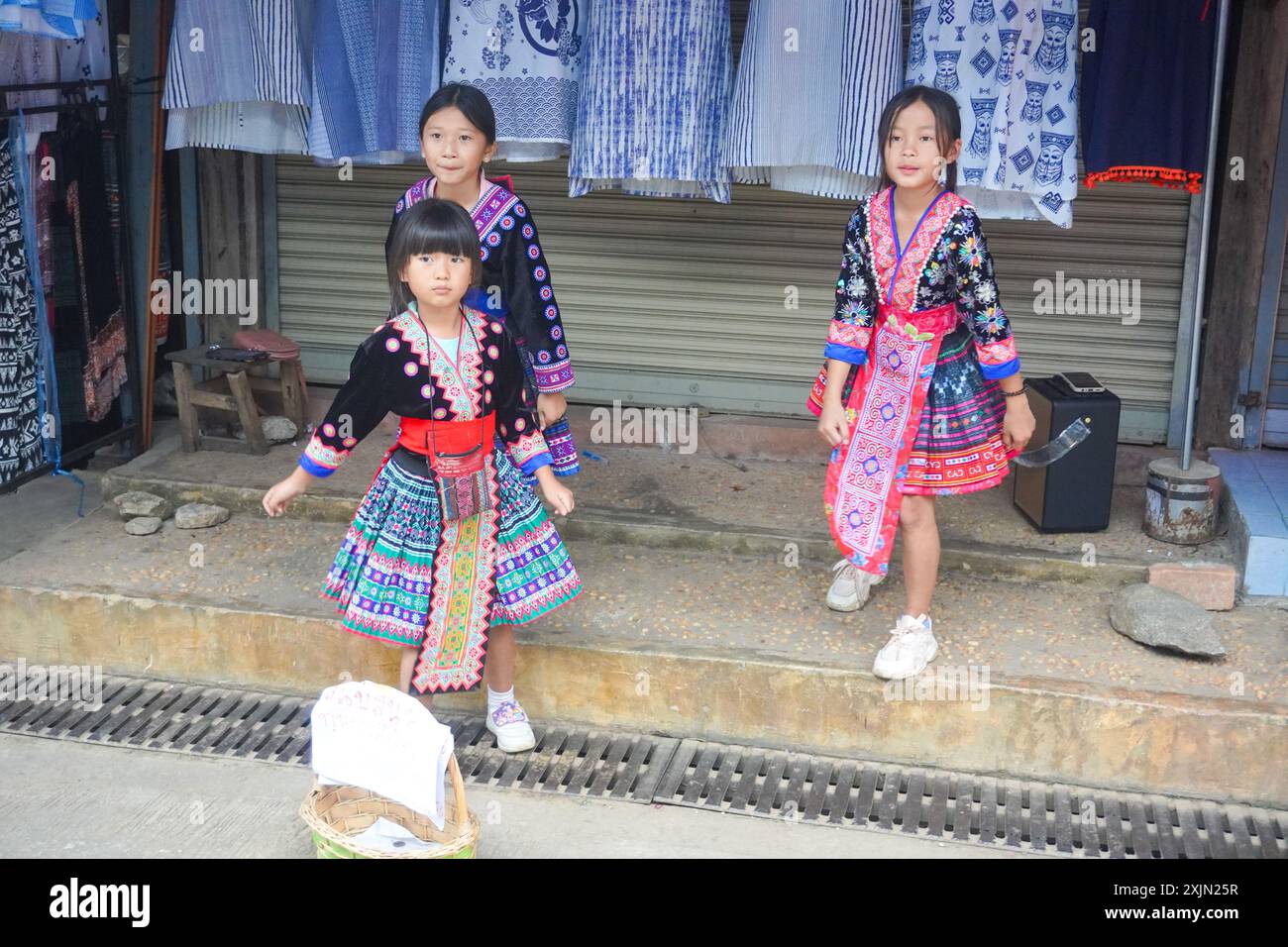 Local kids wearing traditional dress in the small village in Ban Doi ...