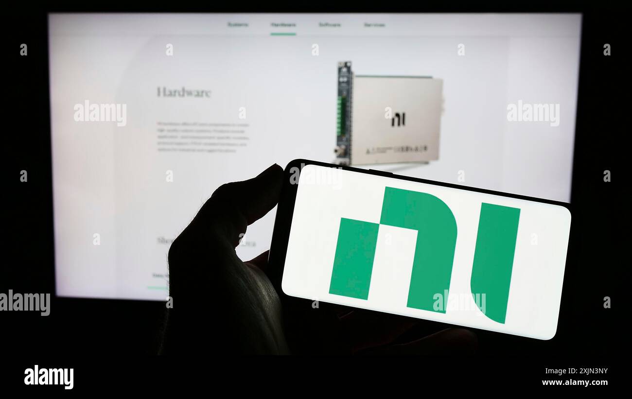 Stuttgart, Germany, 03-23-2023: Person holding cellphone with logo of ...