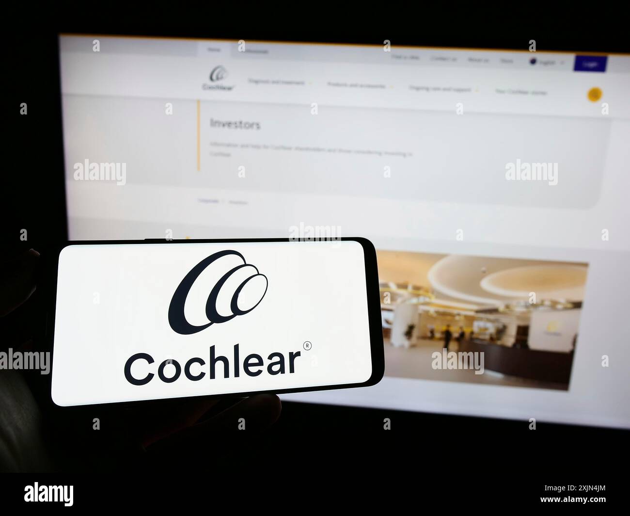 Stuttgart, Germany, 04-02-2023: Person holding cellphone with logo of ...