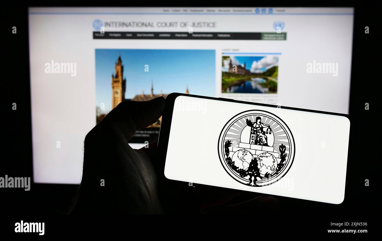 Stuttgart, Germany, 04-23-2023: Person holding mobile phone with logo ...